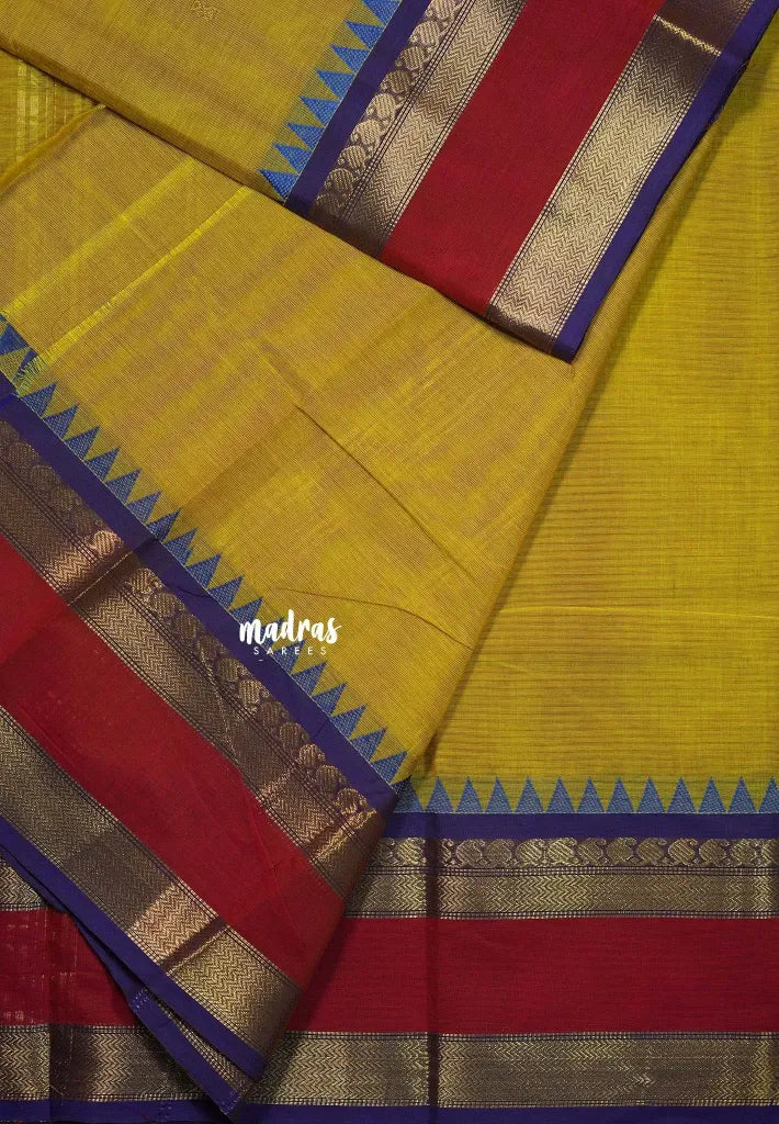 Yellow - Karthigai silk cotton in body with mango and temple skirt bor ...